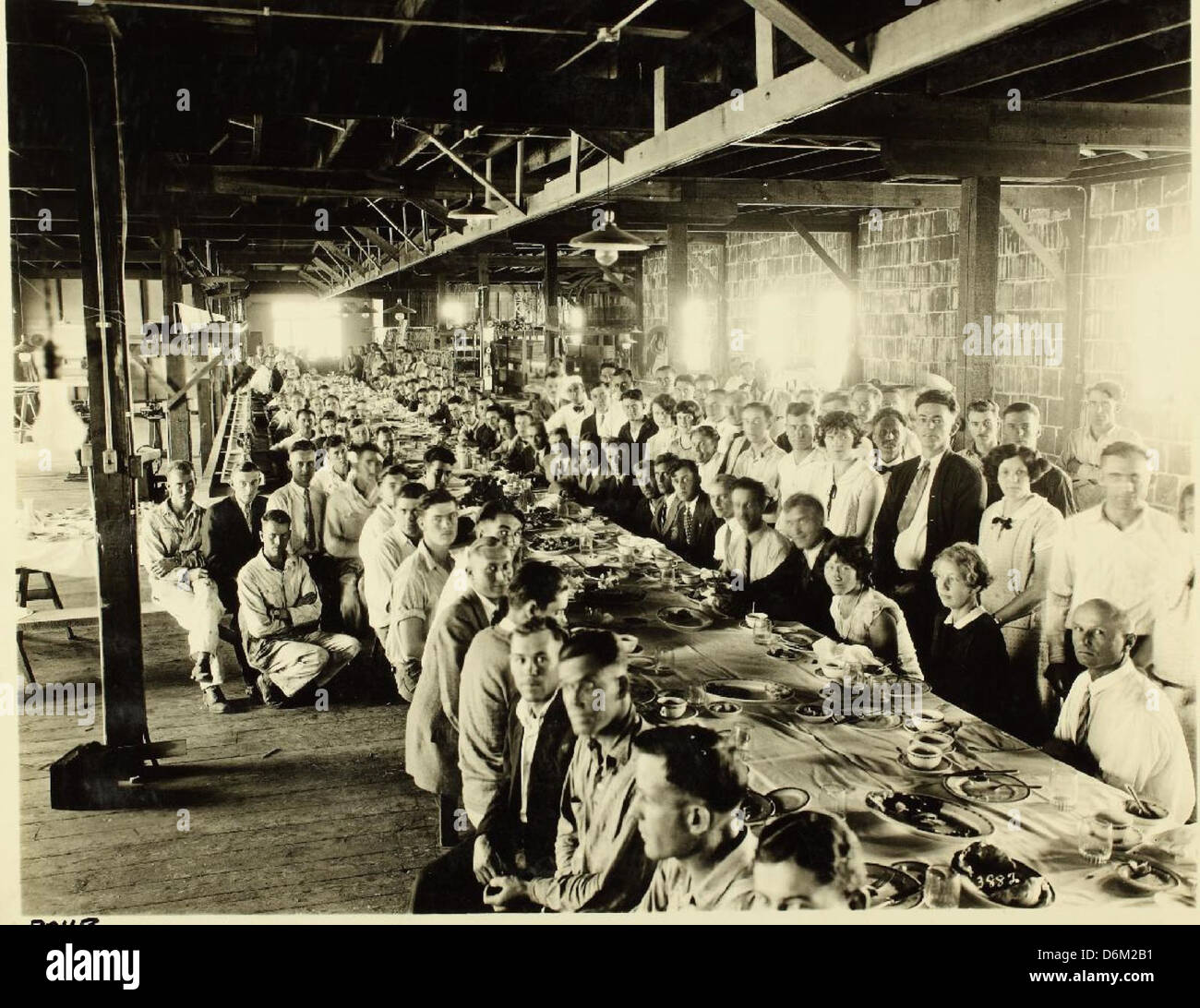 This photograph captures a celebratory lunch event, marking an ...