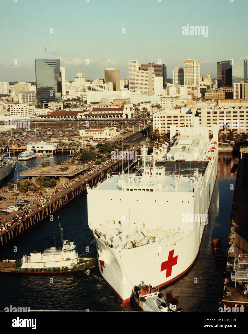This photo captures a Red Cross ship docked in port. The ship served as ...