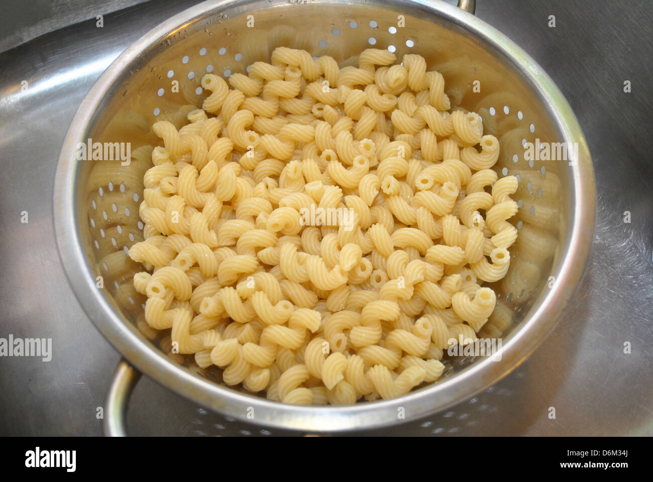 Cooked Cavatappi Pasta in a Strainer Stock Photo - Alamy