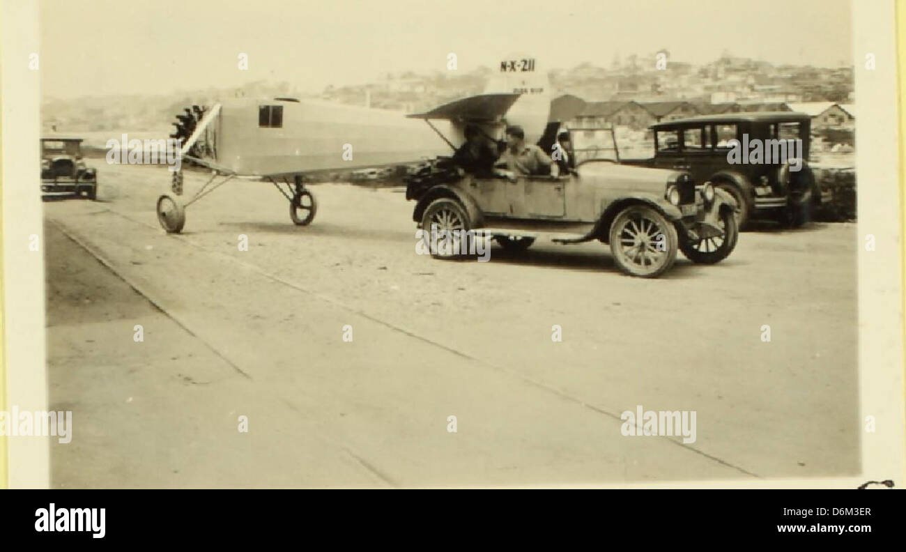 The wing of the iconic Spirit of St. Louis is lifted by a crane during ...