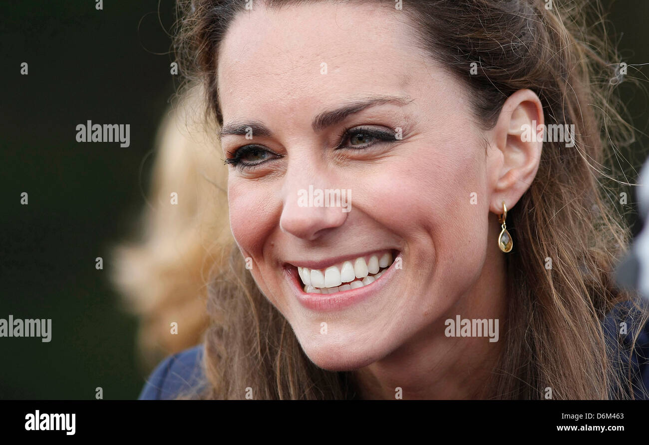 Kate Middleton reacts to the crowd, during a visit to Witton County ...