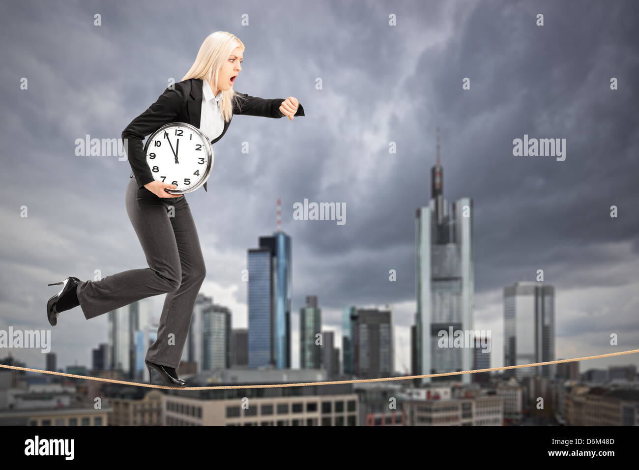 Full length portrait of a businesswoman running on a rope in the ...