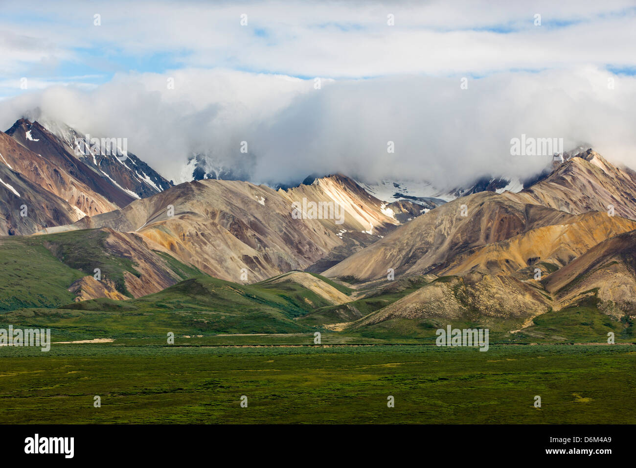 View south of the Alaska Range and clearing skies from Polychrome Pass ...
