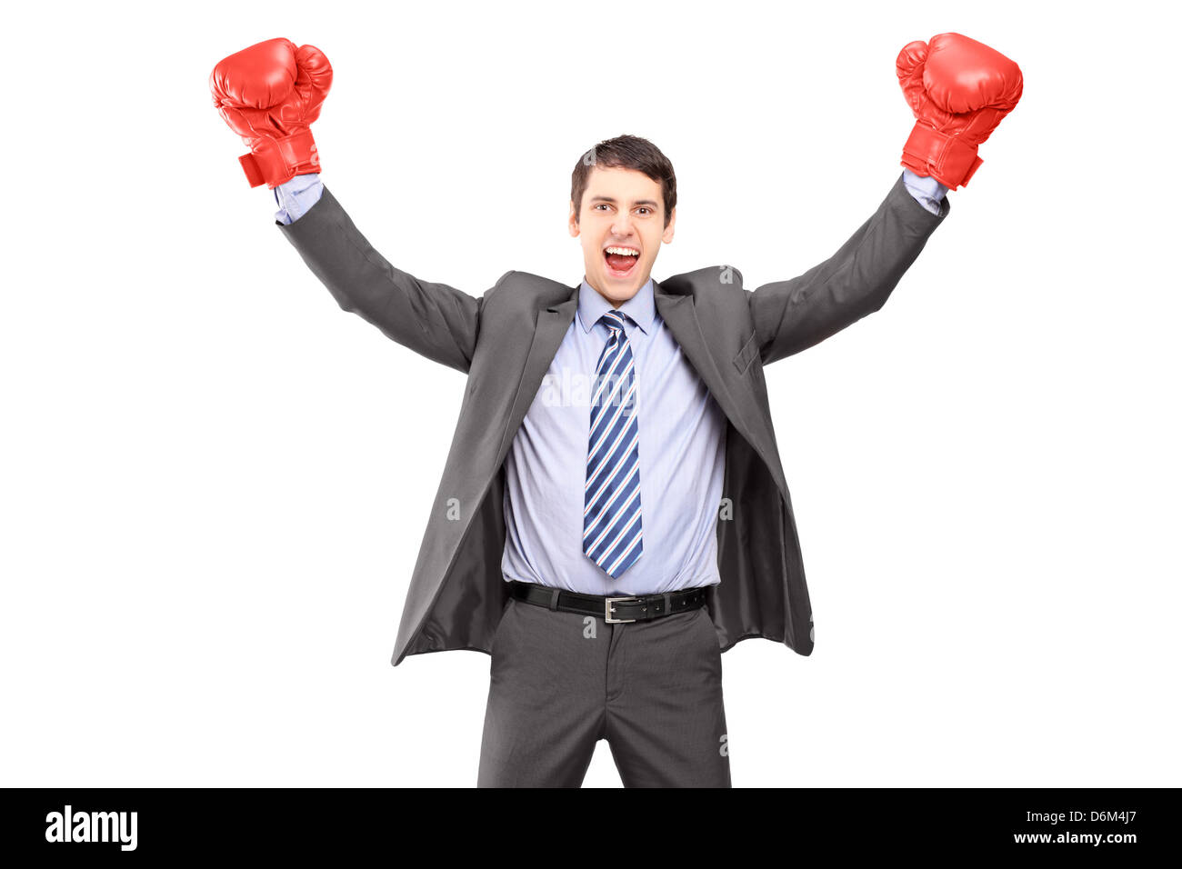 Young man in a suit and boxing gloves, celebrating a win, isolated on ...