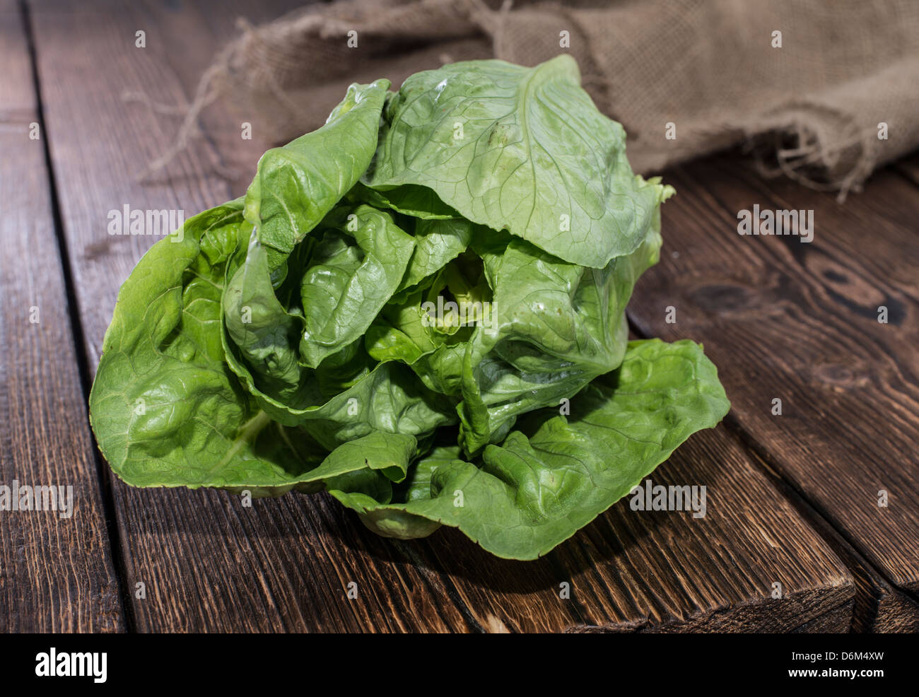 Fresh Lettuce on wooden background Stock Photo - Alamy