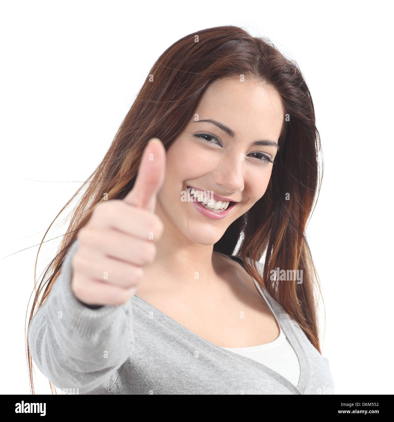 Portrait of a beautiful teen with thumb up gesture on a white isolated ...
