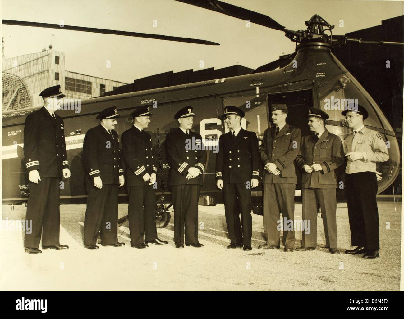 This photograph features helicopter pioneers and dignitaries gathered ...