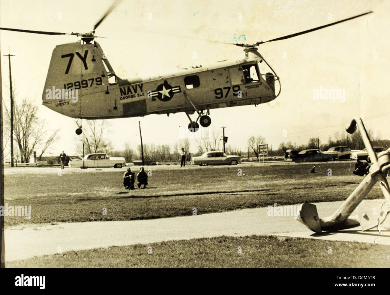 The HUP BuNo 129979, a U.S. Navy helicopter, approaches a landing area ...
