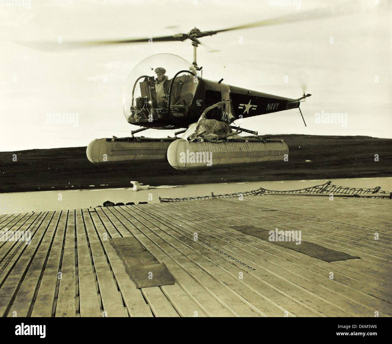 This photograph captures the HTL aircraft aboard a naval ship ...