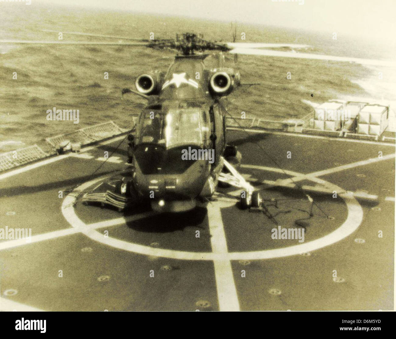 This image shows a damaged SH-2 Sea Sprite helicopter after an accident ...