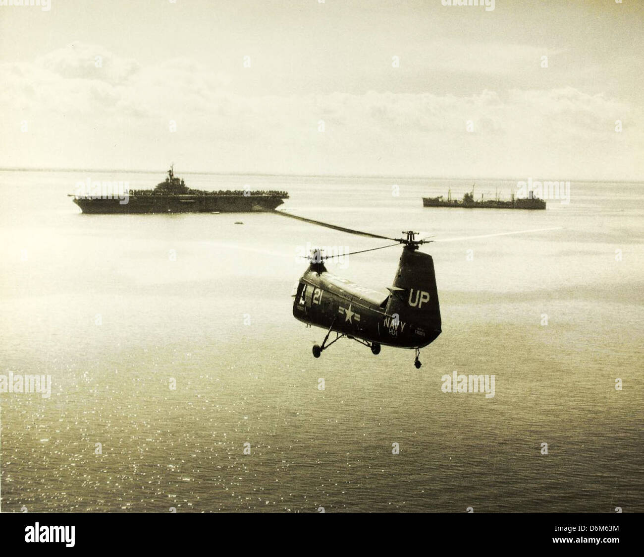 This photograph depicts the HUP helicopter operating aboard the USS ...