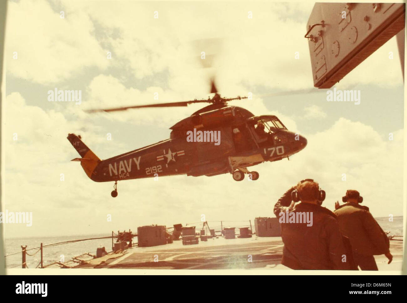 The HC-4S H-2 helicopter is shown landing aboard a Navy ship. The H-2 ...