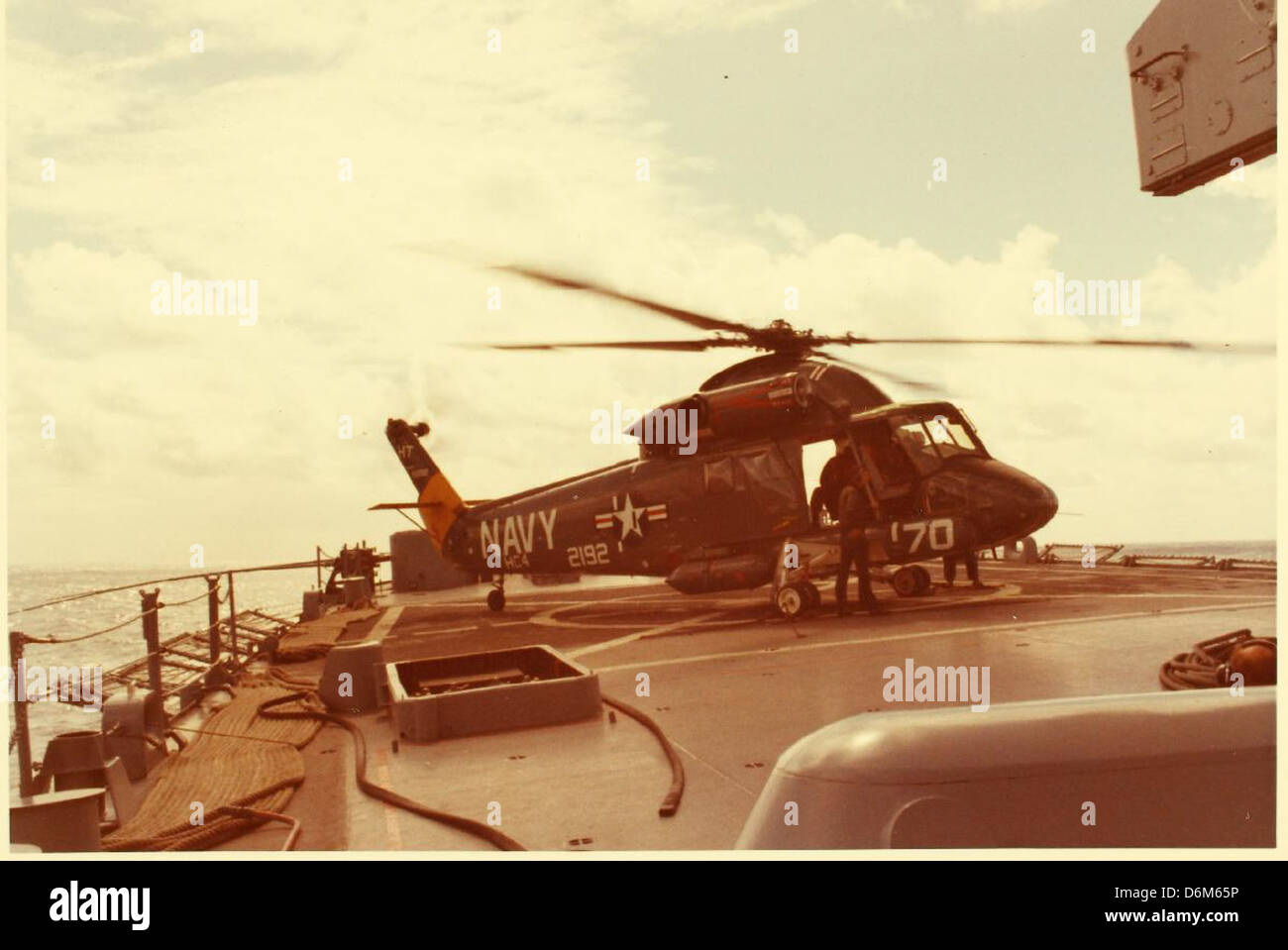 This photo captures an HC-4S H-2 helicopter landing aboard a U.S. Navy ...