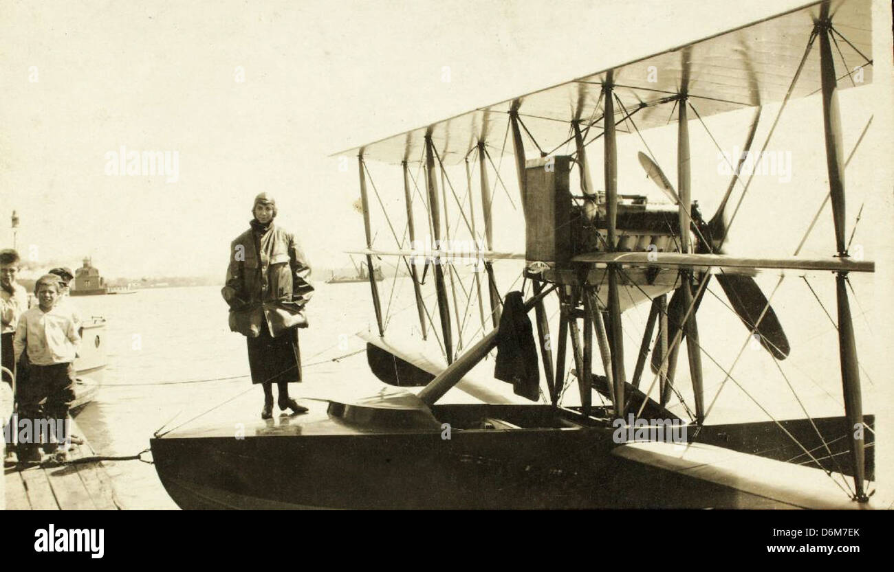 This photograph features a unique triplane flying boat, an early ...