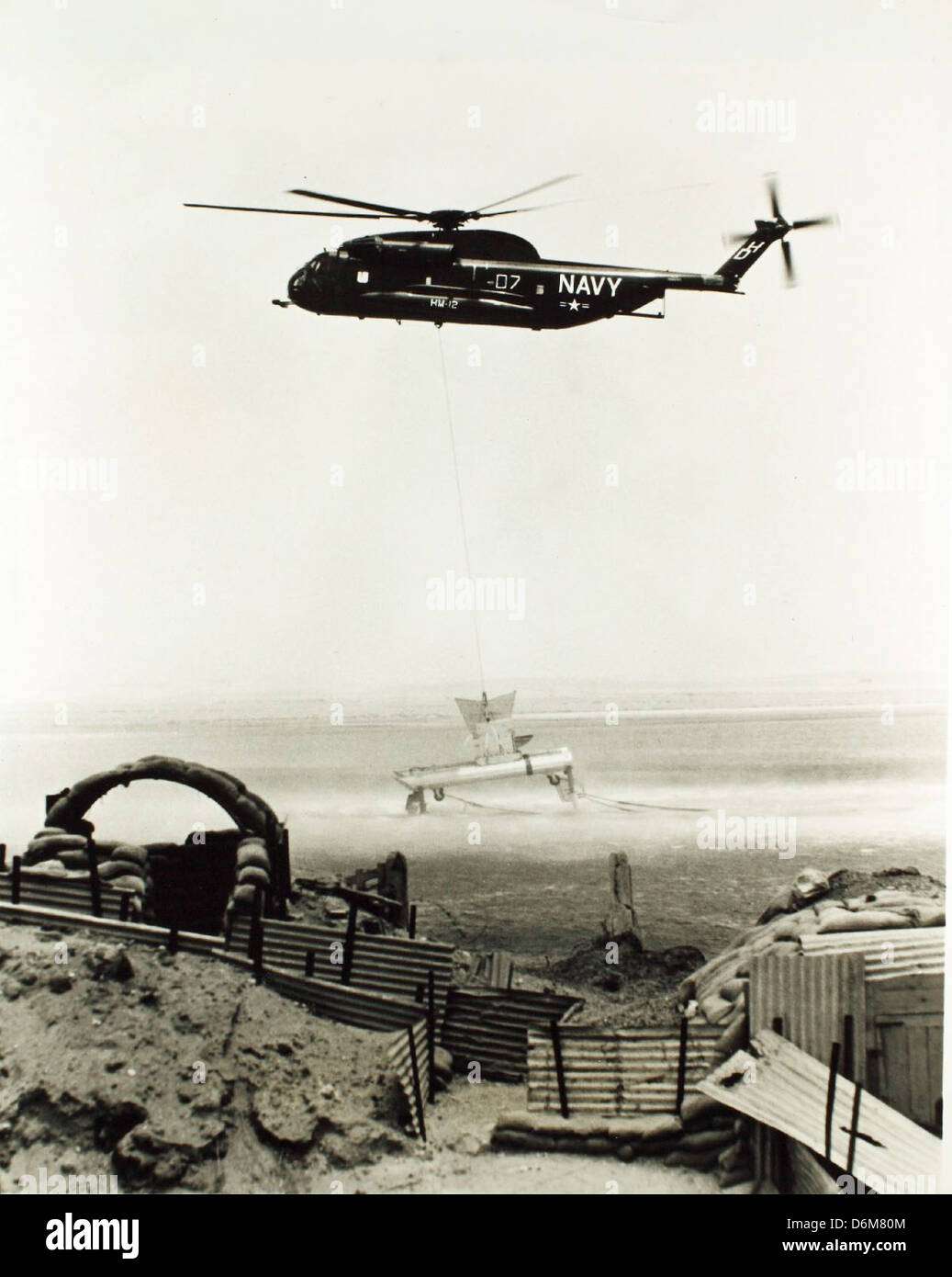 Navy RH-53D lifting a Mark 105 Magnetic mine sweeping device, Suez ...
