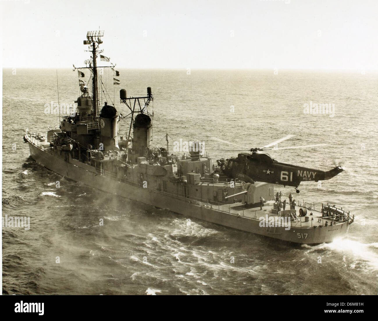 SH-3A #61 of HS-4 hoisting a person aboard DD-447 NHHS Photo Stock ...