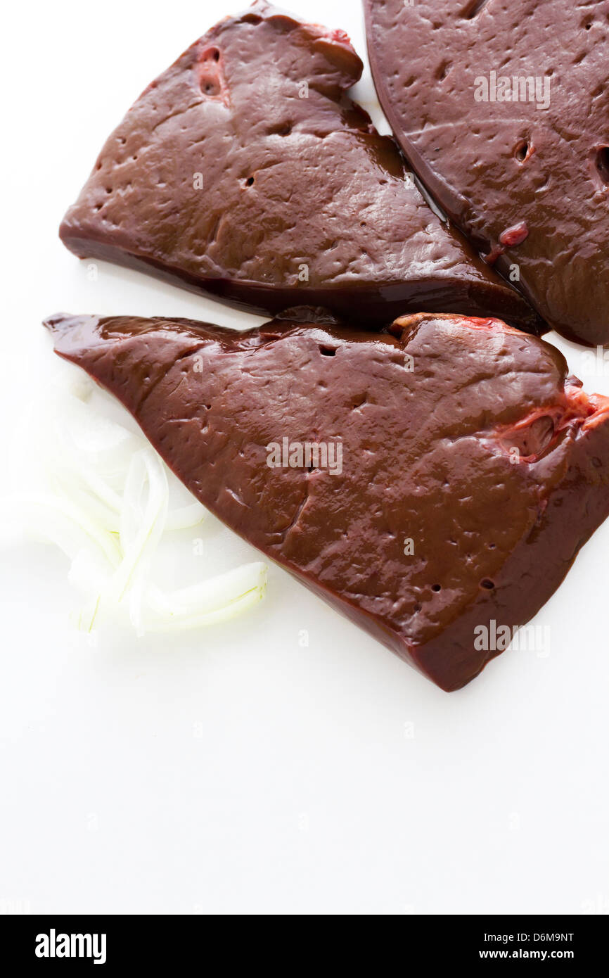 Raw beef liver with white onions on a white backgroung Stock Photo - Alamy