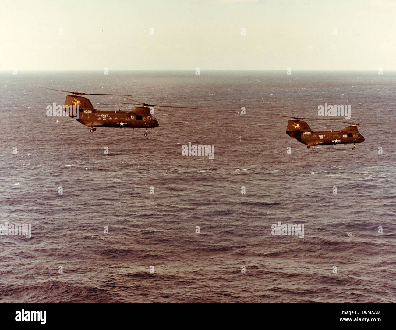This photograph shows two H-46 helicopters in flight above the ocean ...