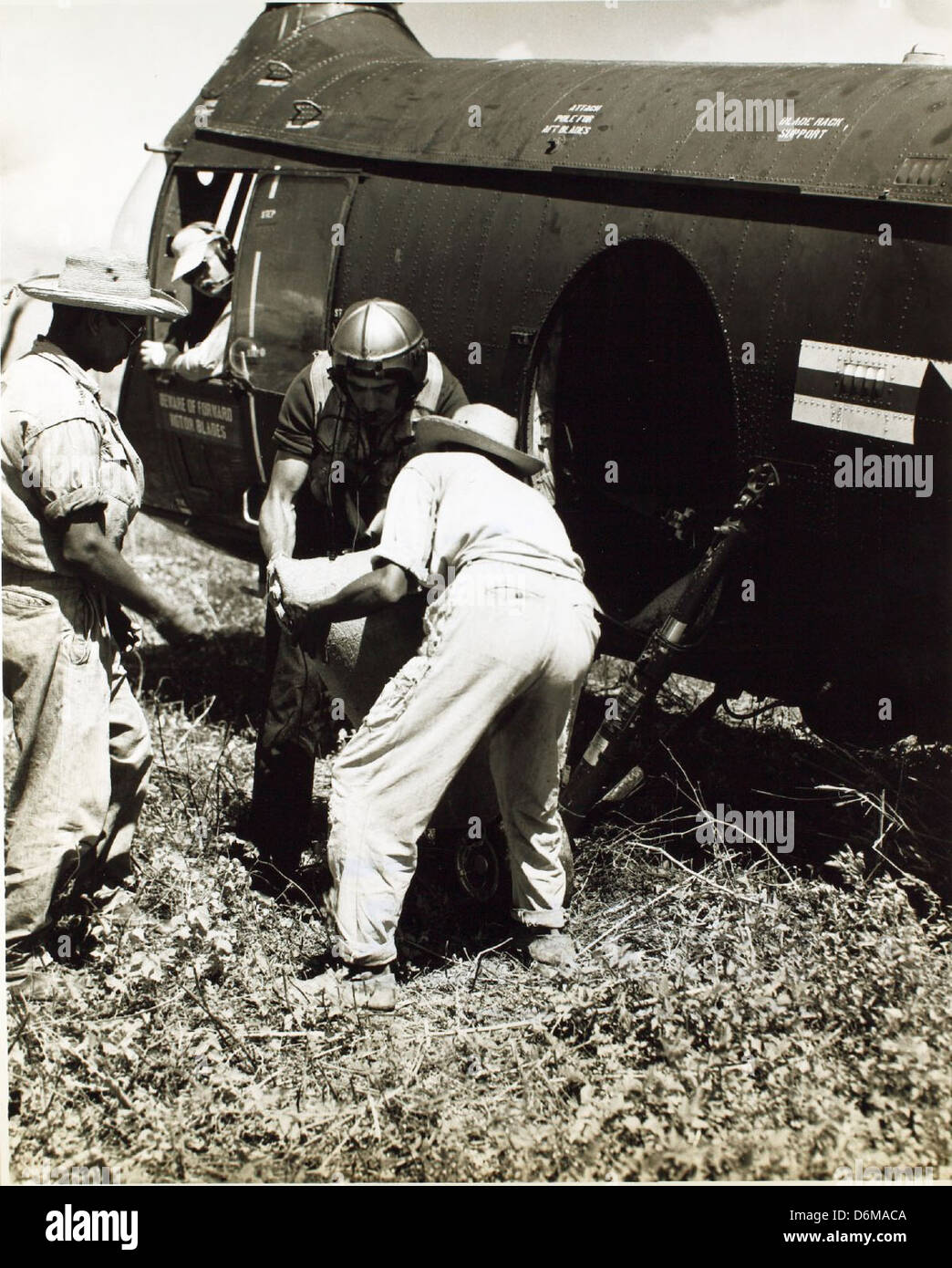 Helicopter crew from HTU-1, stationed aboard the USS Saipan, aided ...