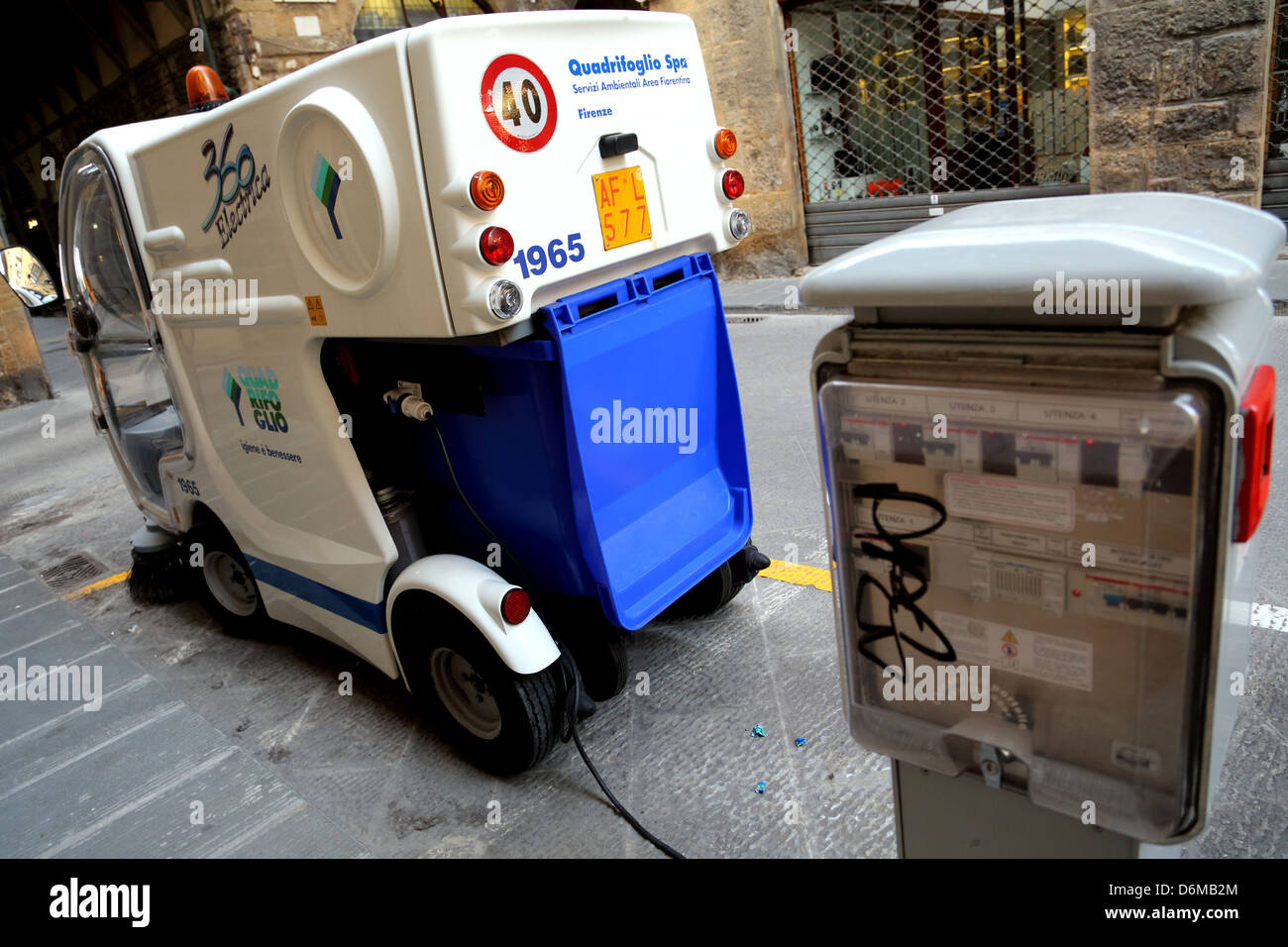 Battery powered street sweeper being recharged overnight in Florence ...