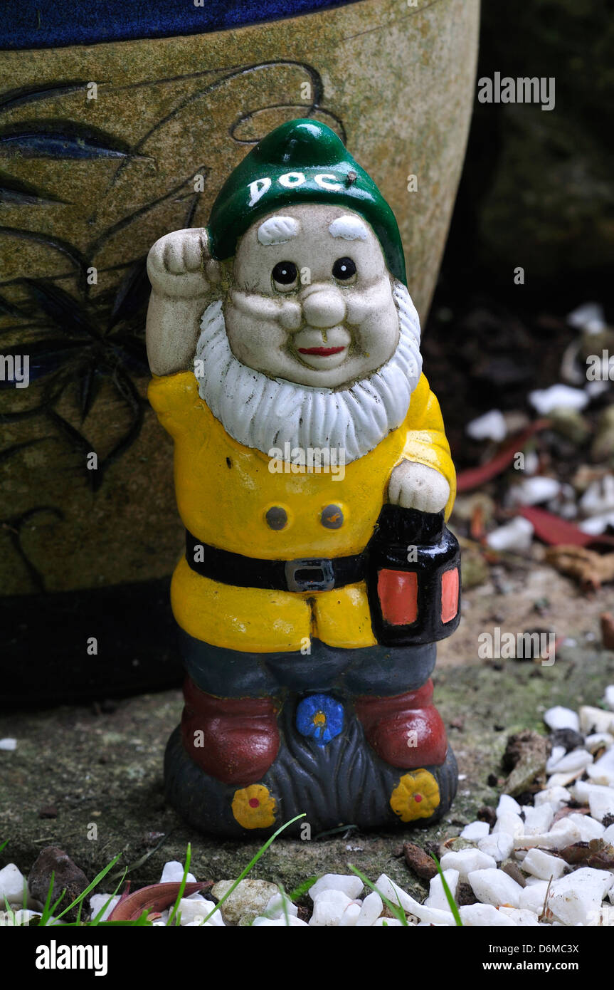 One of the seven dwarves disguised as a garden gnome in a garden UK ...