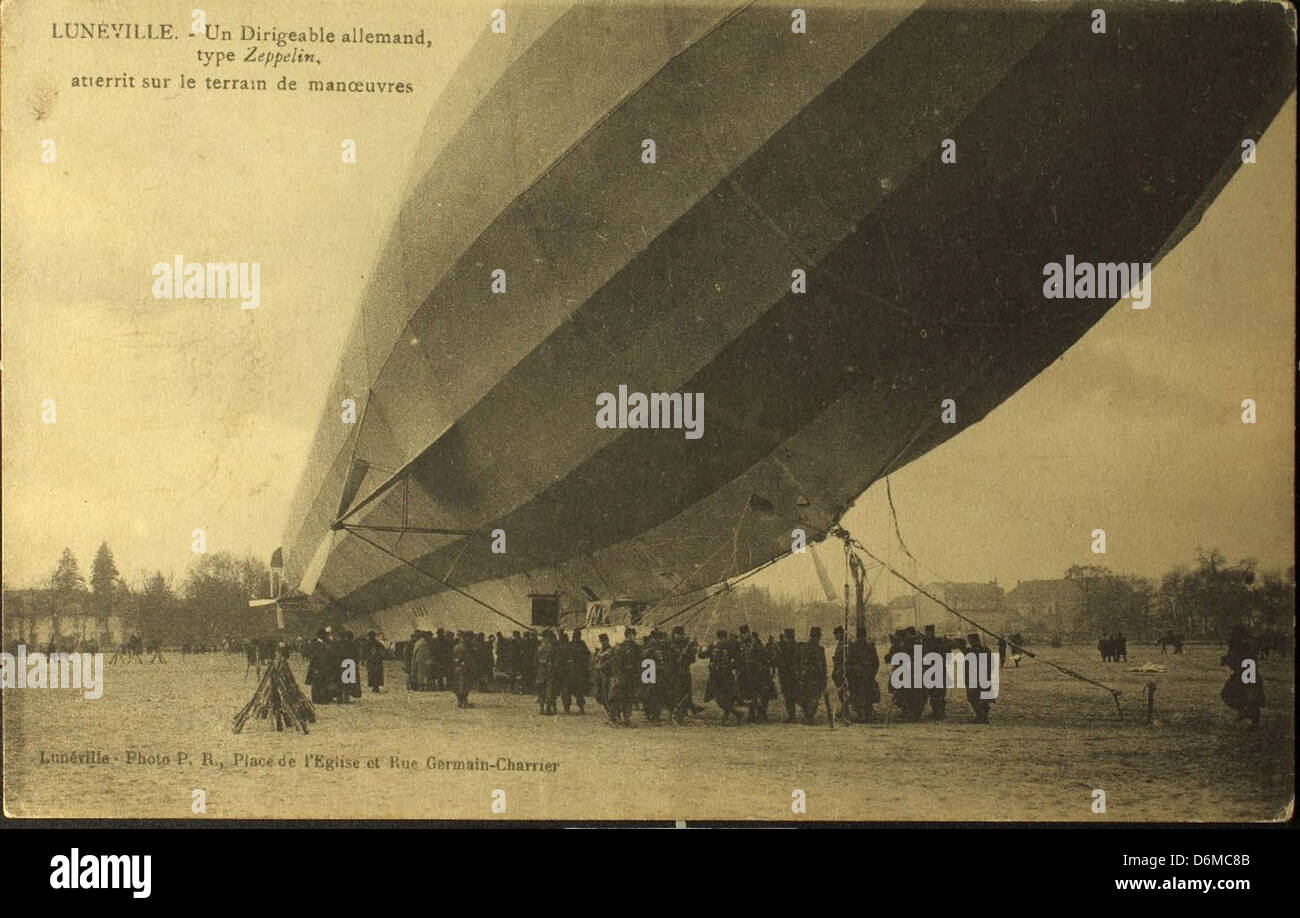 This postcard features a Zeppelin, a type of rigid airship, over ...