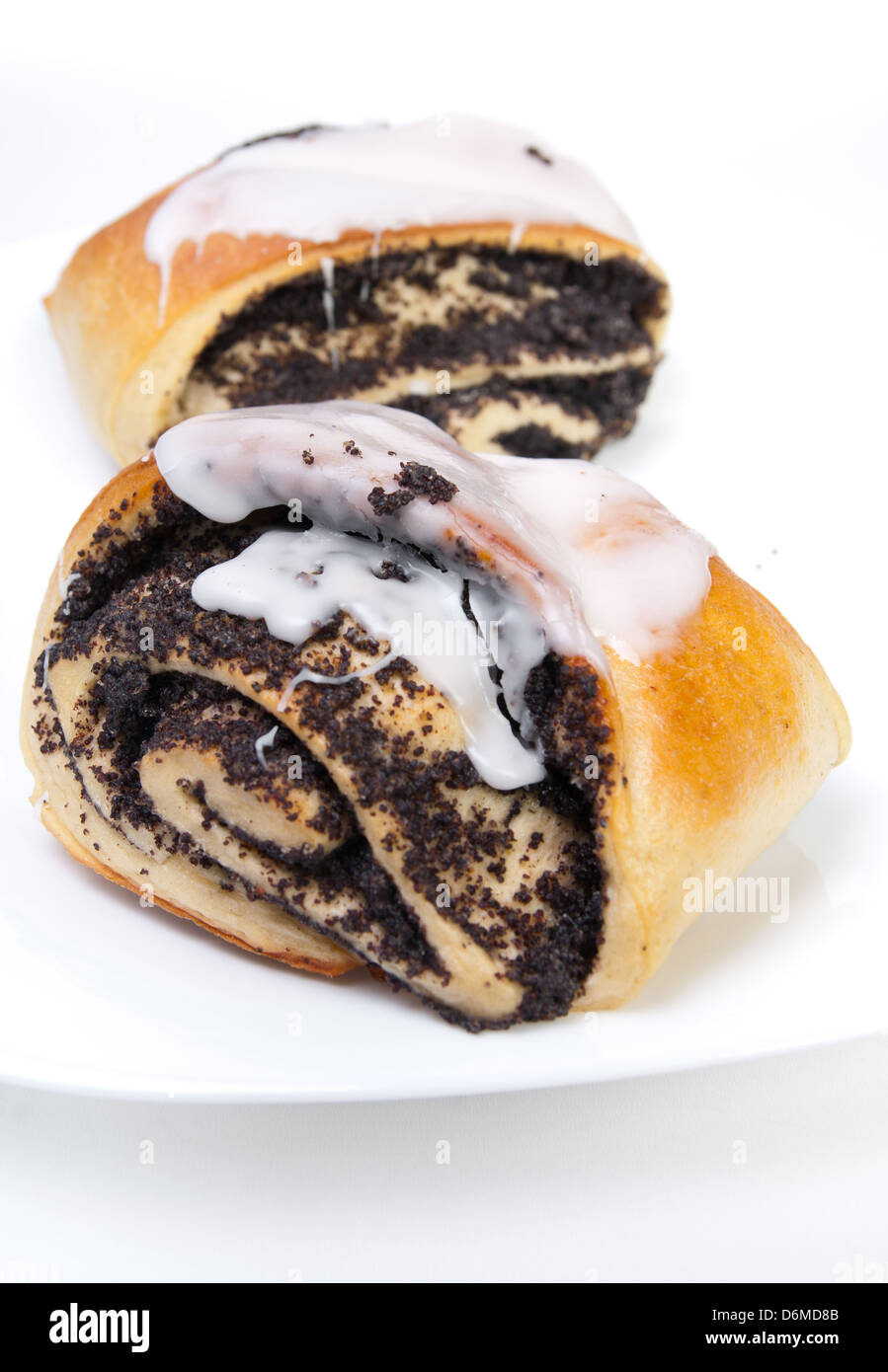 sweet bun with poppy seed on color kitchen composition Stock Photo - Alamy