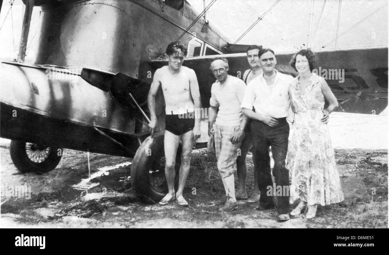 This photograph shows Captain Mitchell and passengers with a Loening ...