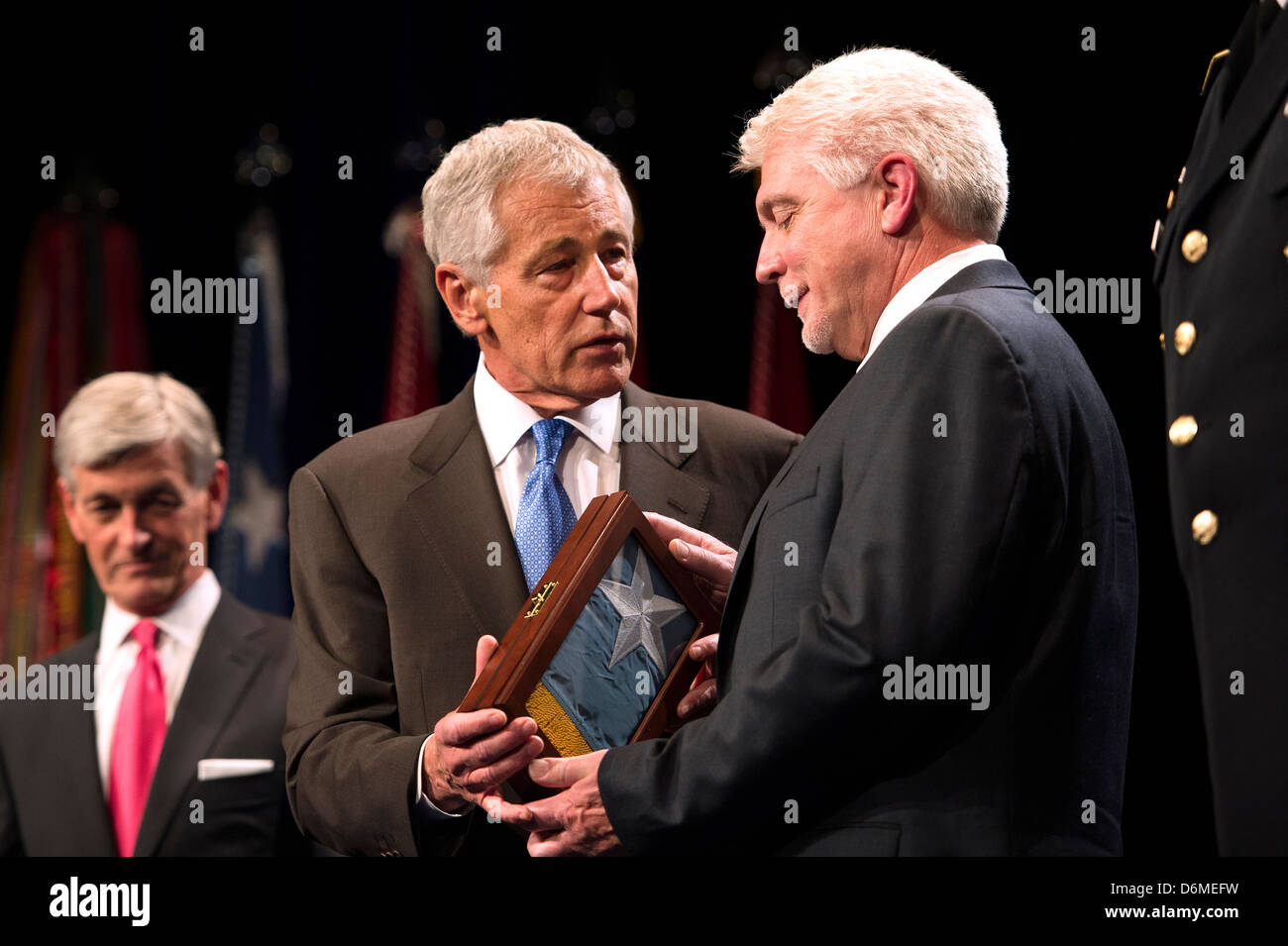 US Secretary of Defense Chuck Hagel presents the Medal of Honor flag to ...