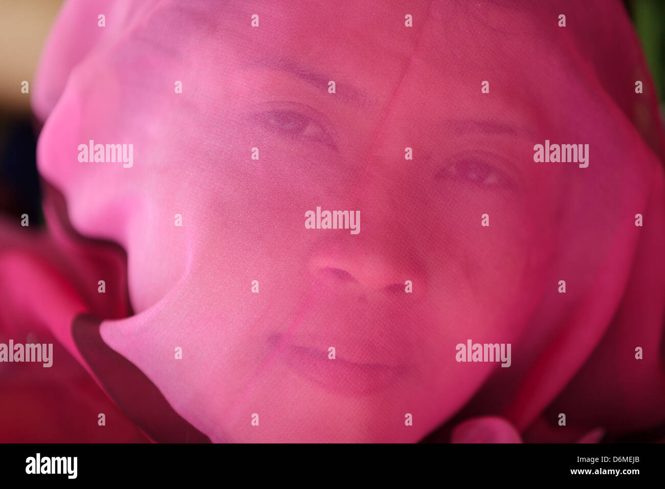 Female face covered cloth hi-res stock photography and images - Alamy