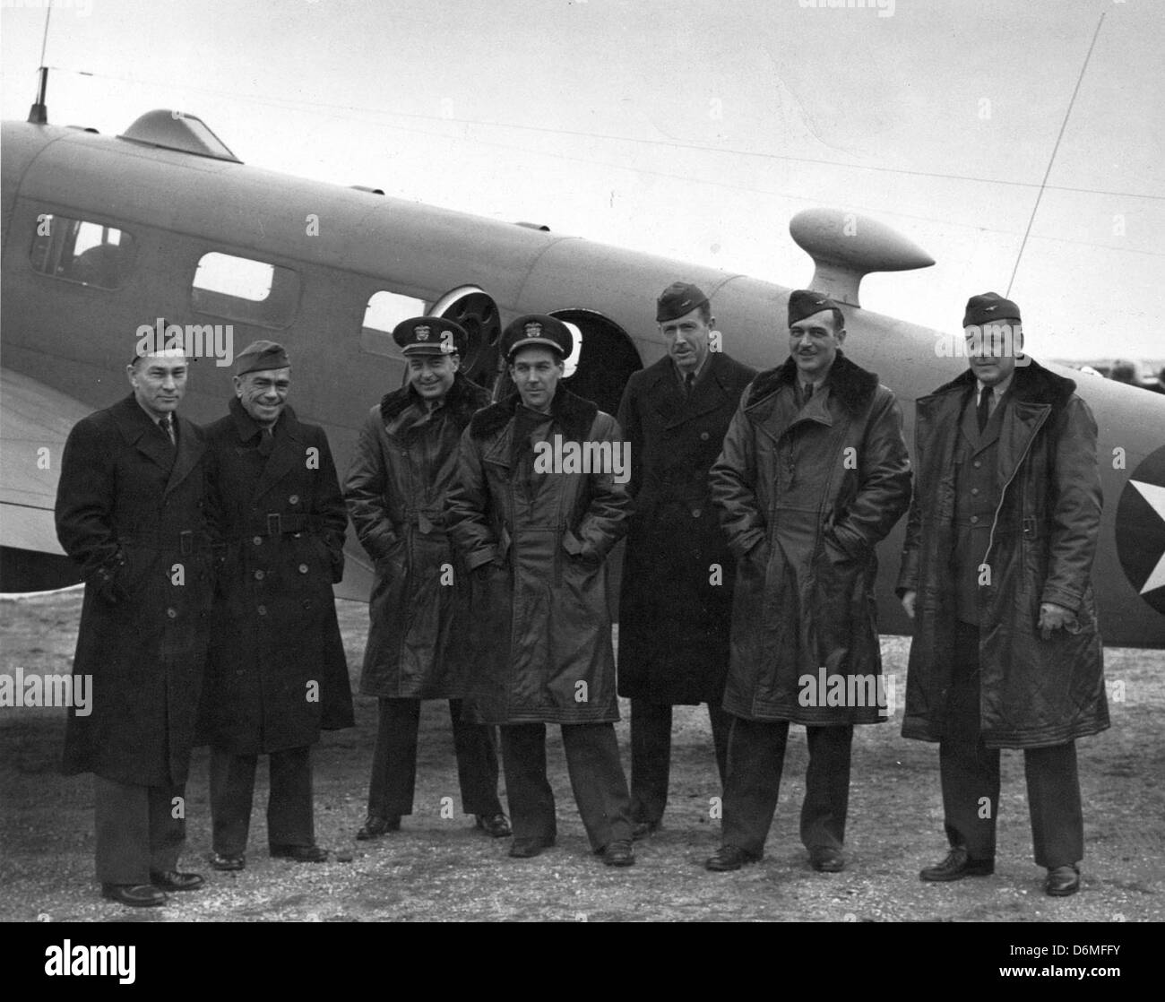 This is a group photo showing personnel involved in aviation ...