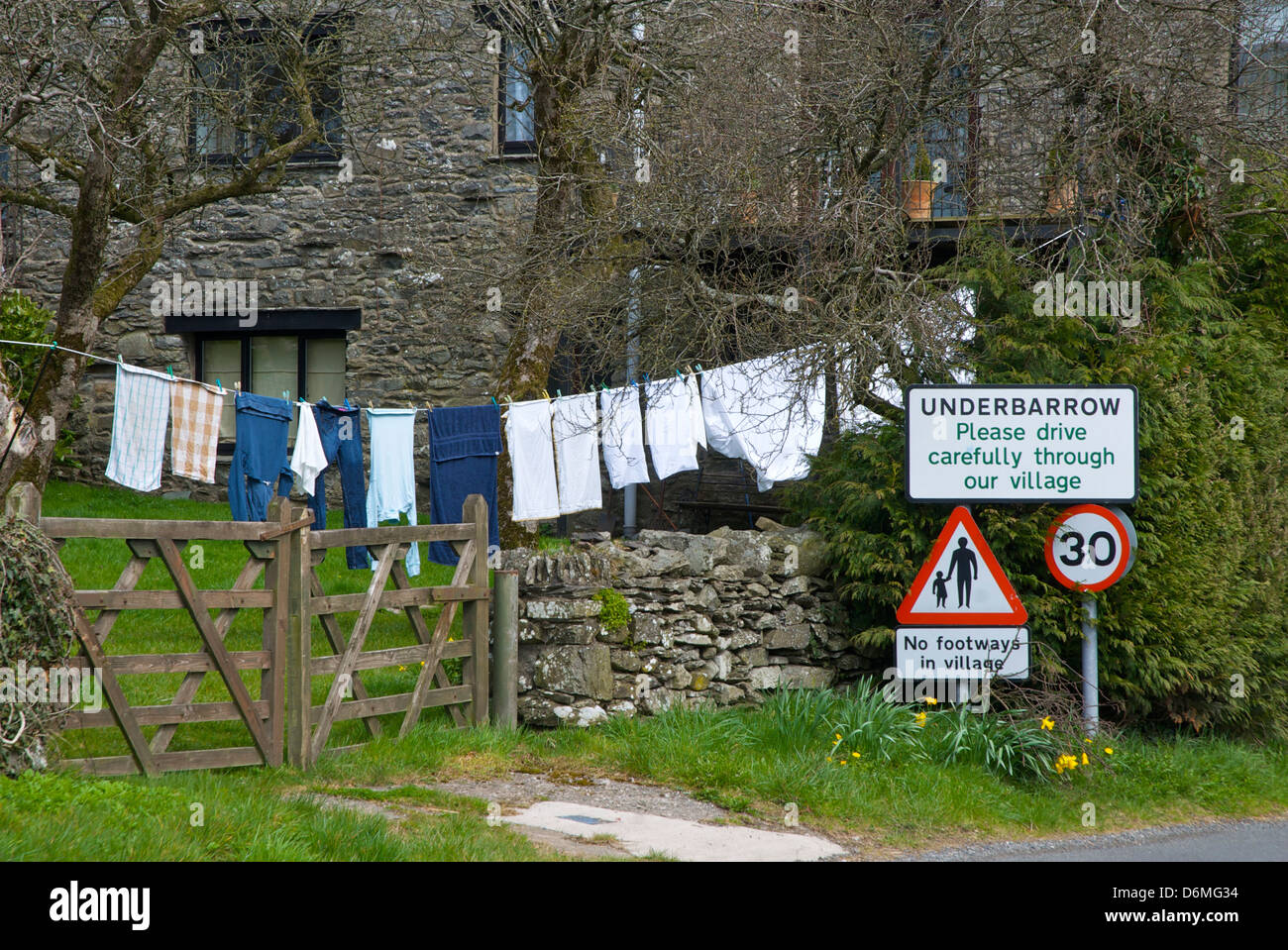 Please drive carefully through our village sign hi-res stock ...