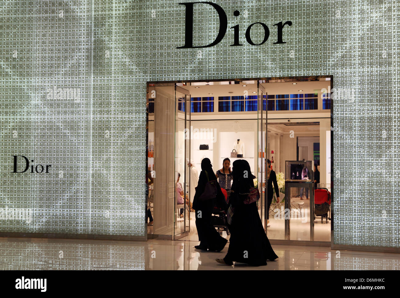 Dubai, United Arab Emirates, women walk past a branch of Christian Dior ...