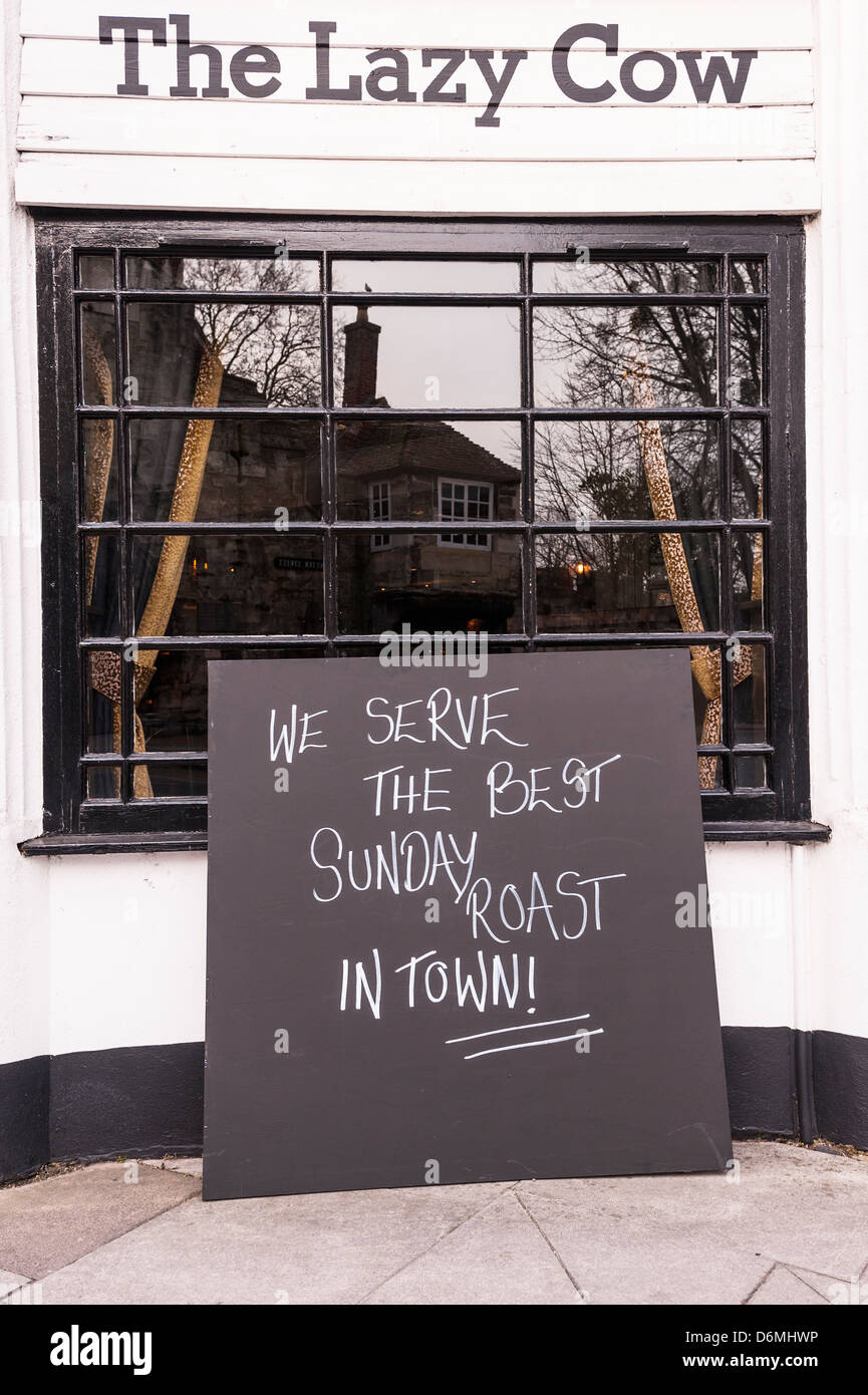 A pub sign telling of the best Sunday roast in town in Salisbury ...