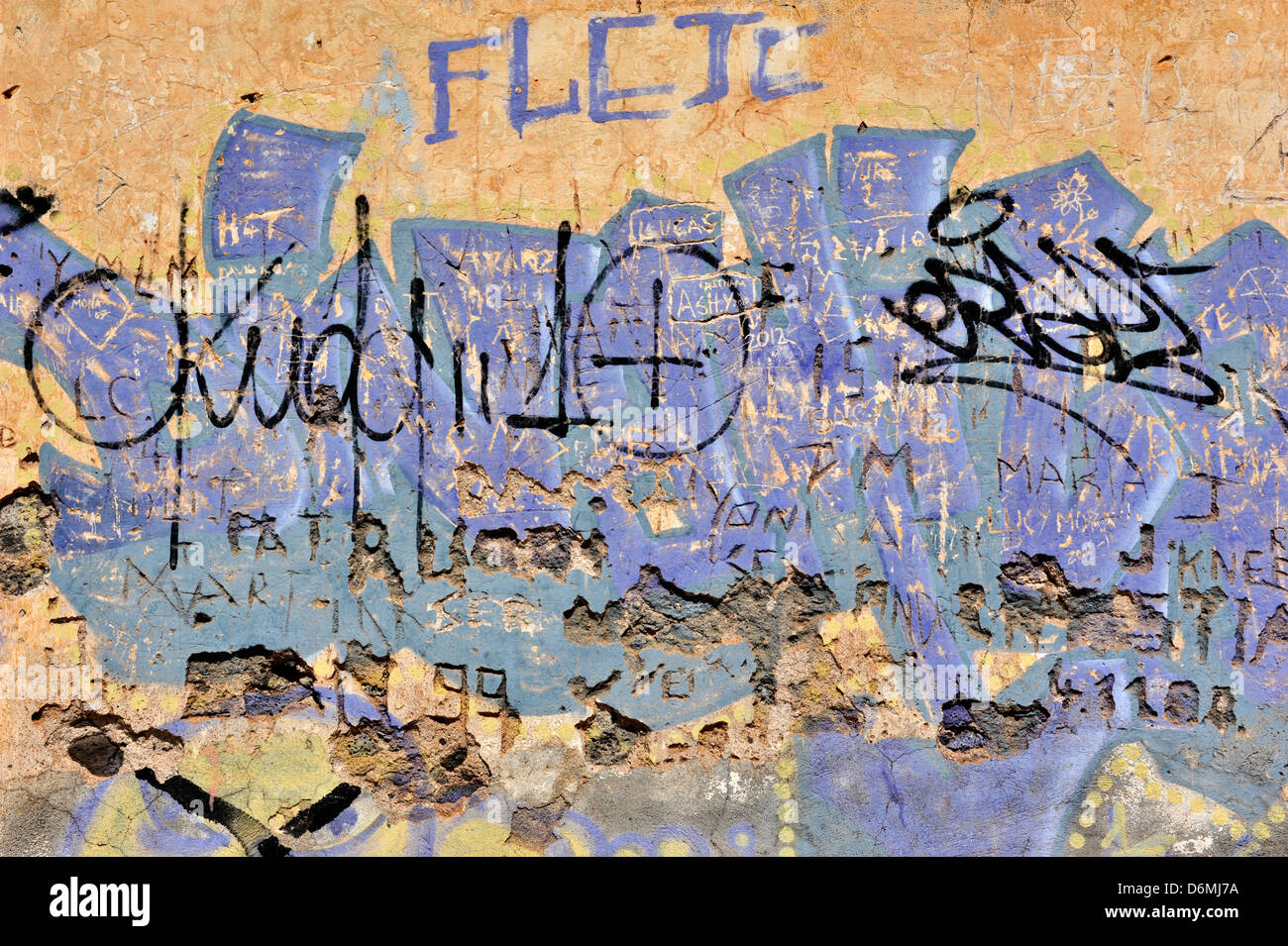 Graffiti on a stone wall Stock Photo - Alamy