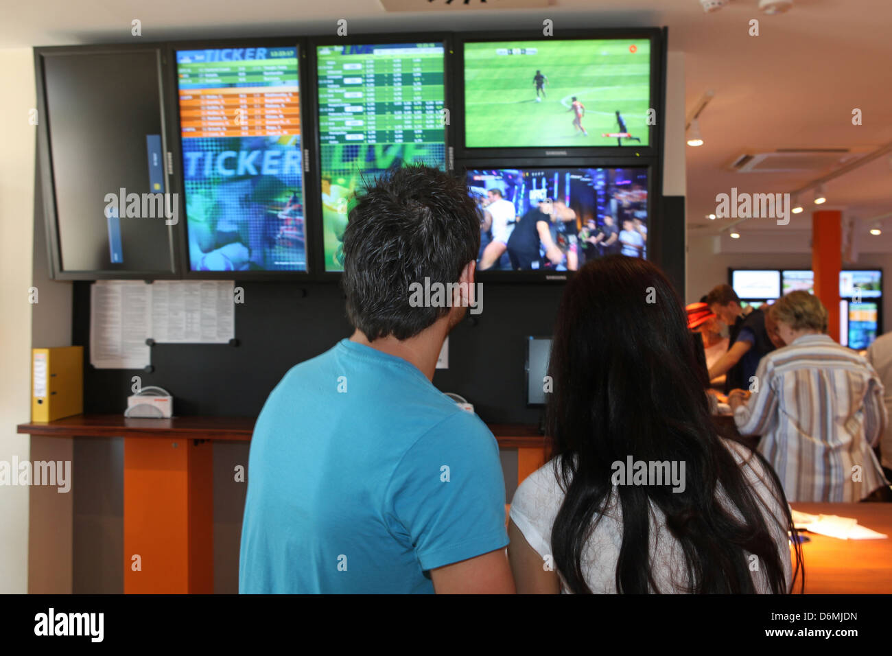 Leipzig, Germany, people in a Bookmakers look at the monitors Stock ...