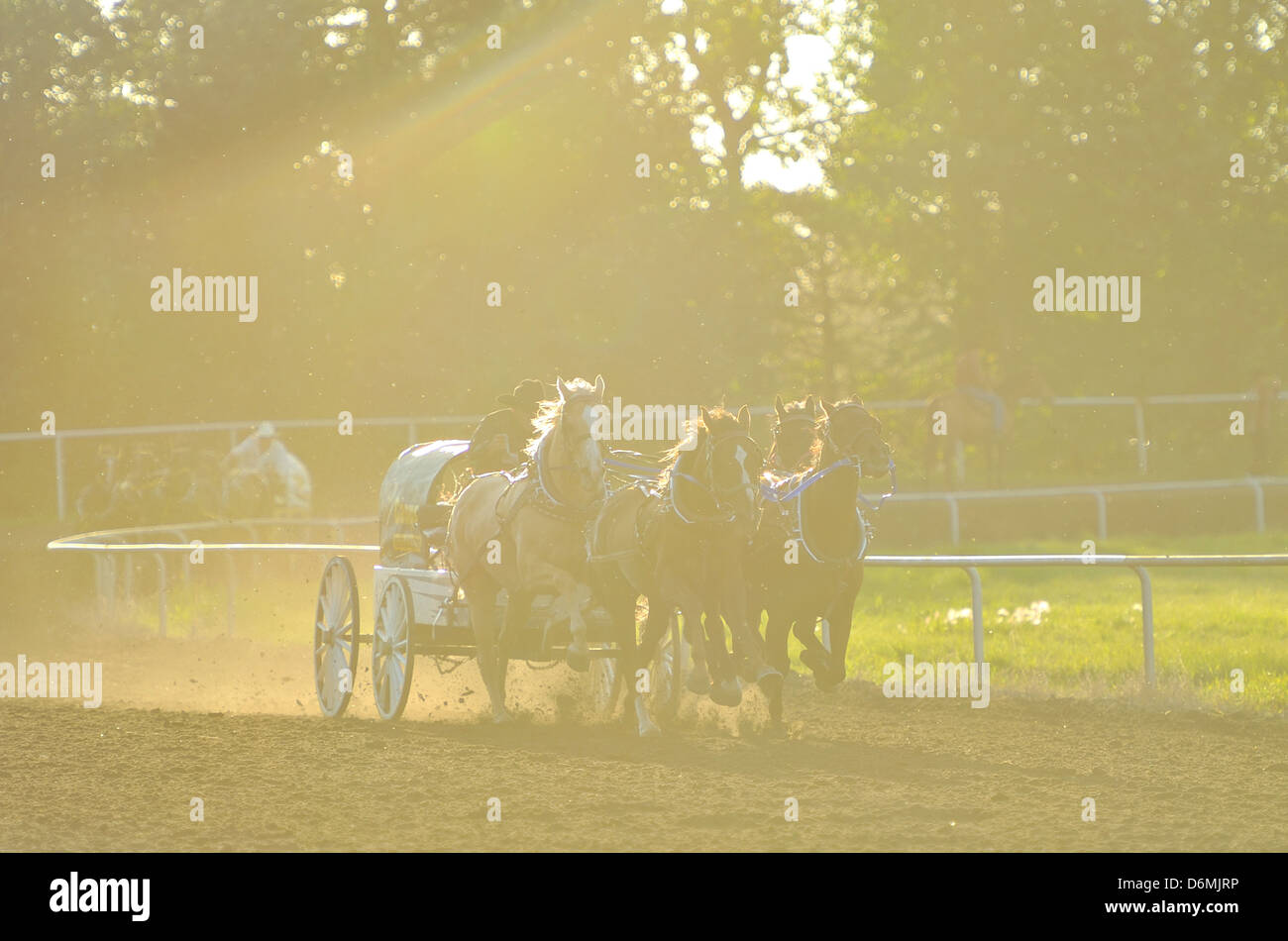 Evening light backlighting a mini chuck wagon rounding a turn Stock ...