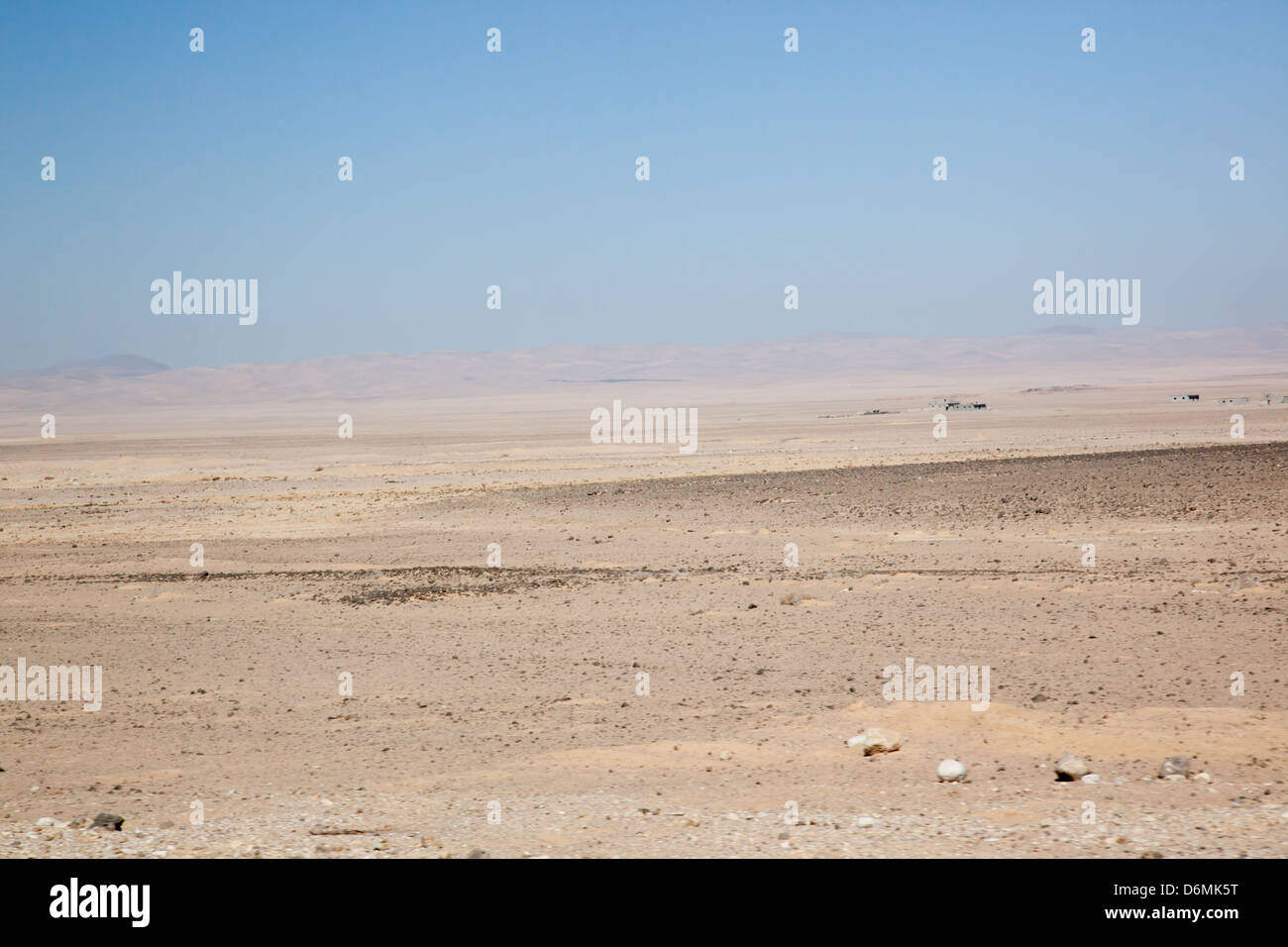 Desert, dry and sparse vegetation, with lots of sunshine and blue sky ...