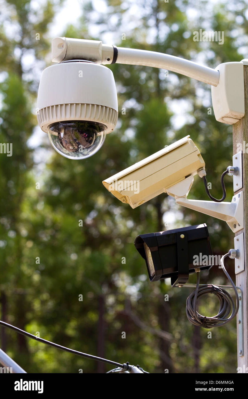 Two surveillance video camera and an emergency light are mounted to an ...