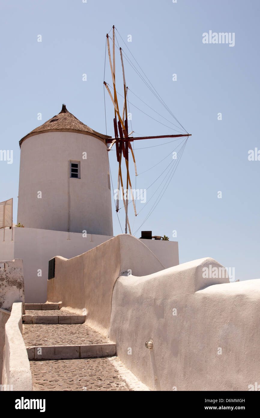 Traditional Greek windmill against [blue sky], Oia, Santorini, Greece ...