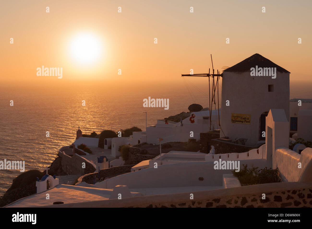 Windmill and sunset, Oia, Santorini, Greece Stock Photo - Alamy