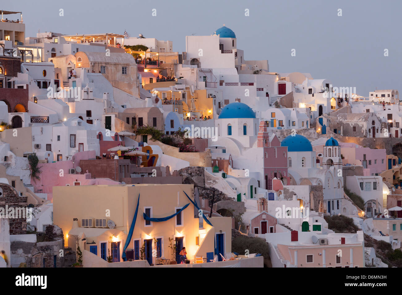 White buildings of Oia village at dusk, Santorini, Greece, Europe Stock ...