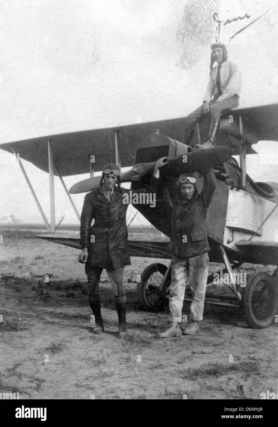 This photo shows Jim Hester with two aviators beside a Curtiss JN ...