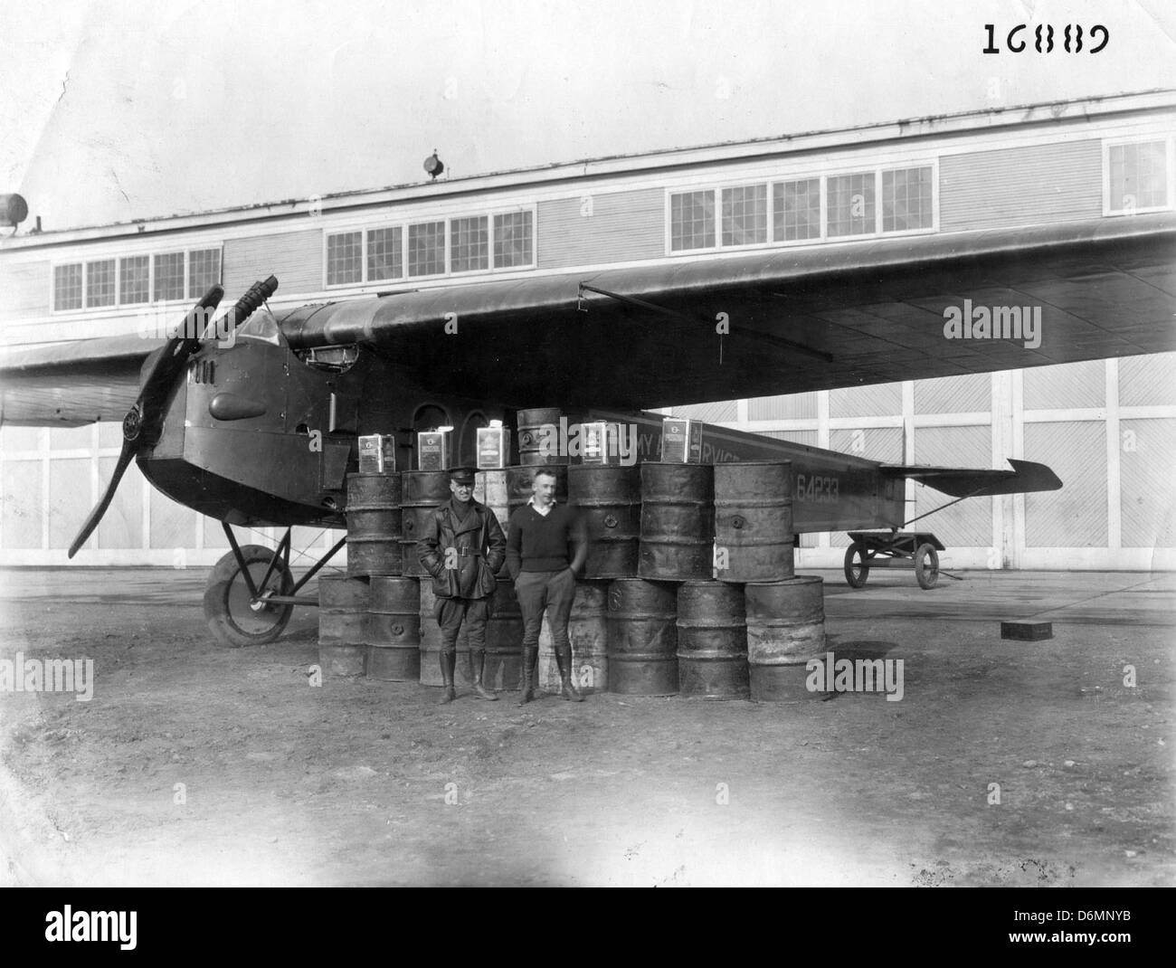 The Fokker T-2, an early transport aircraft, is shown with fuel drums ...