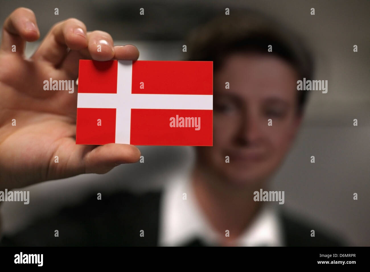 Businessman is holding a business card, flag of Denmark Stock Photo - Alamy