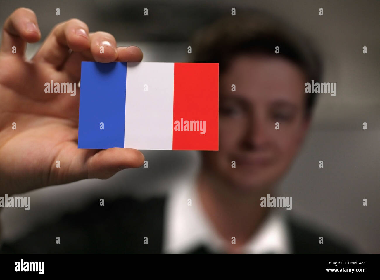 Businessman is holding a business card, flag of France Stock Photo - Alamy