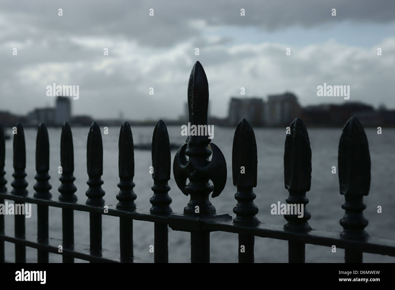 spike covered fence tower of london era storm clouds Stock Photo - Alamy