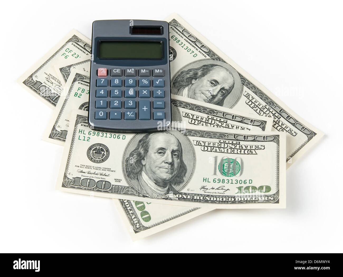 American dollars and calculator on white background Stock Photo - Alamy