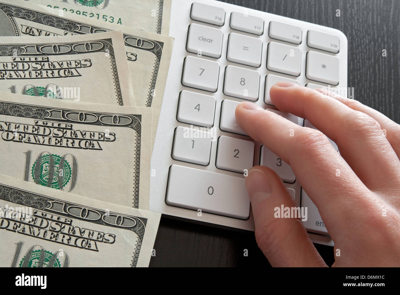 Calculator 100 dollars accounting hi-res stock photography and images ...