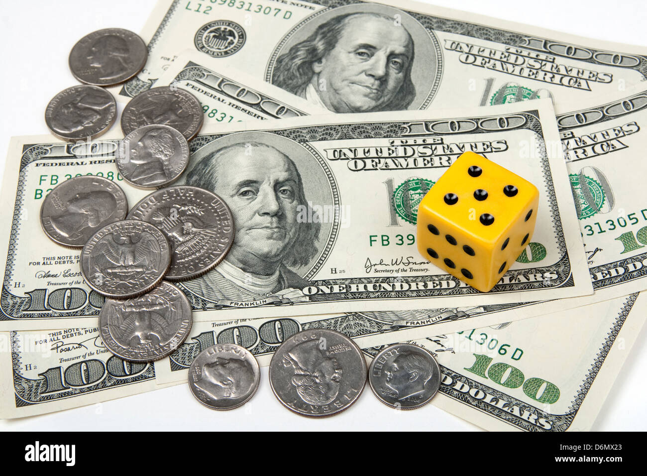 Yellow dice, paper money and coins. Gambling concept Stock Photo - Alamy